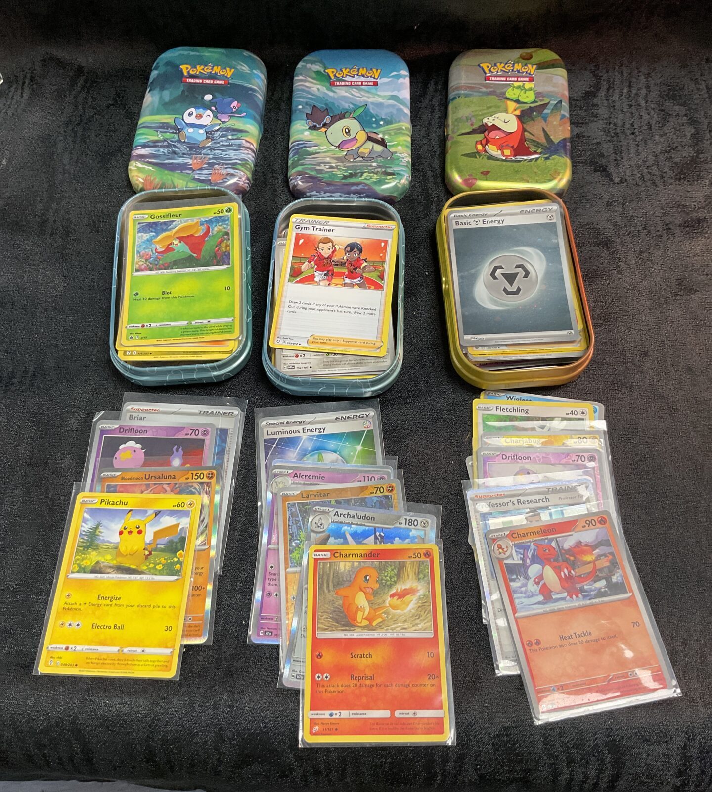 Three tins of Pokemon cards – Badgers Auctions
