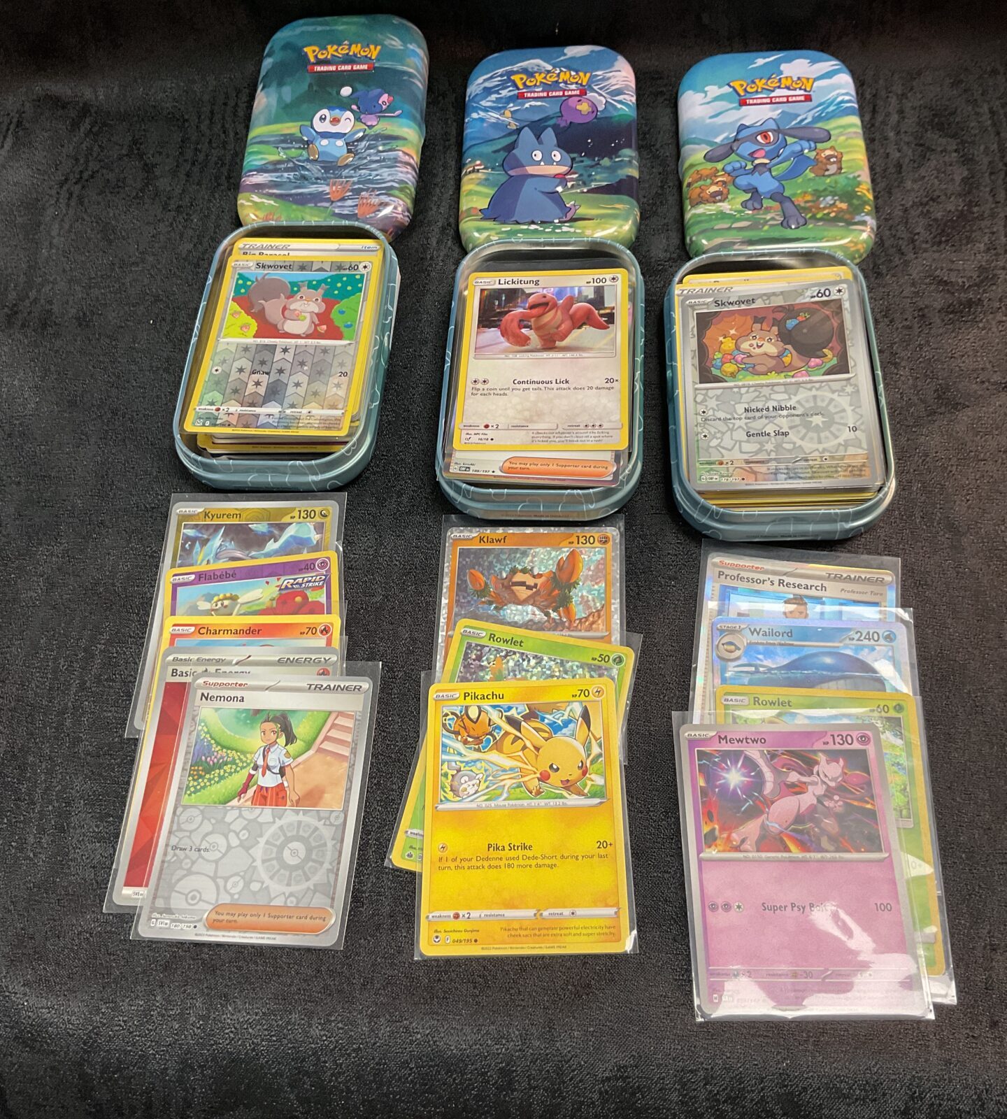 Three tins of Pokemon cards – Badgers Auctions