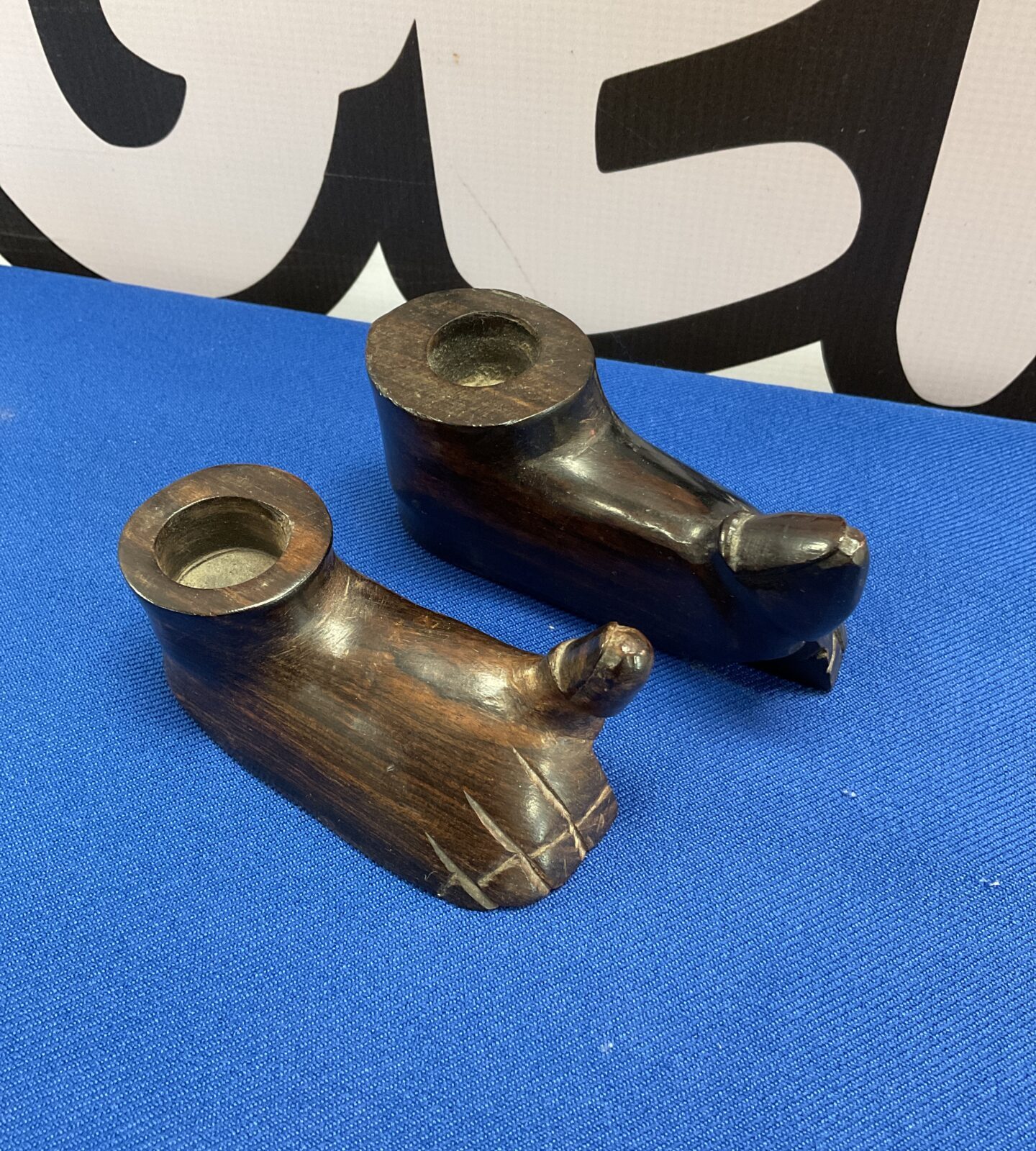 Two vintage carved African hardwood feet chamber-sticks – Badgers Auctions