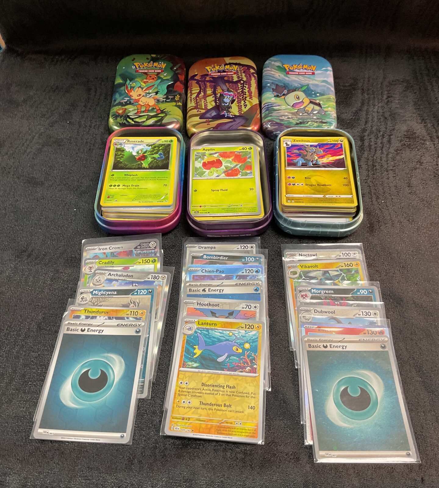 Three tins Pokemon cards – Badgers Auctions