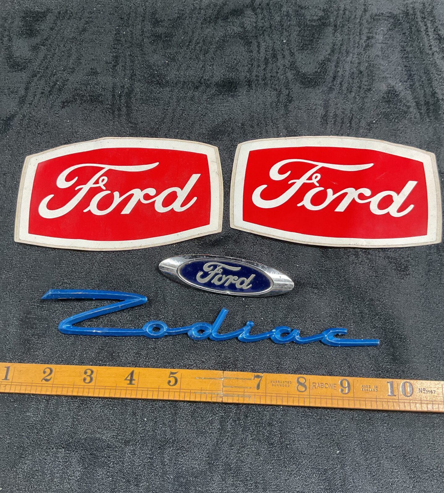 Two Ford badges zodiac and Ford oval and two stickers – Badgers Auctions
