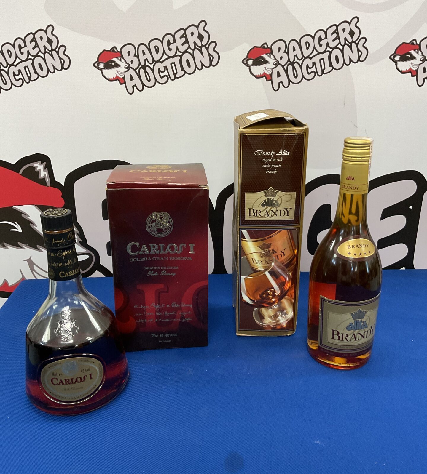Sealed bottle of alita brandy & opened bottle of carlos i – Badgers ...