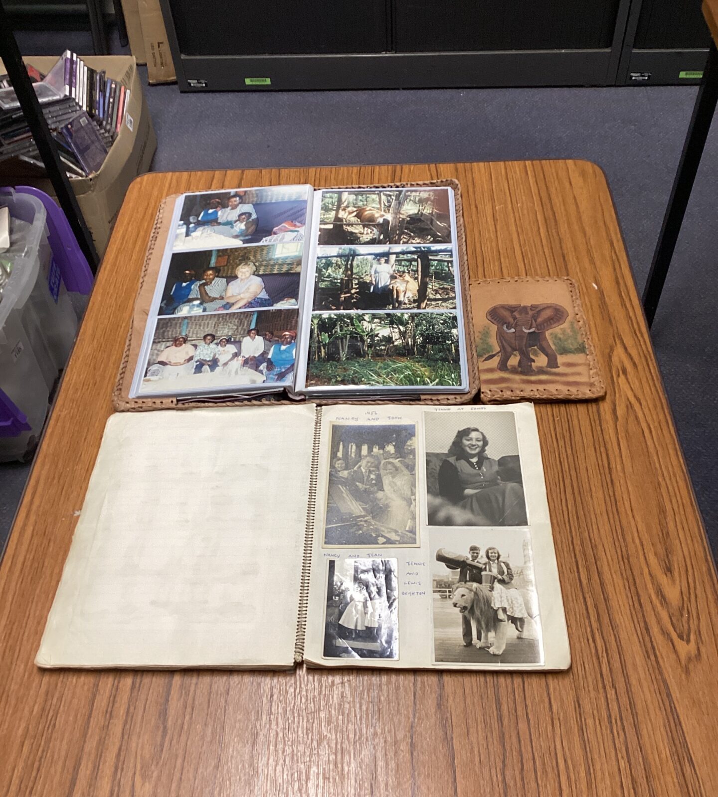 Two African leather bound folders with notepad & photos & ring bound ...