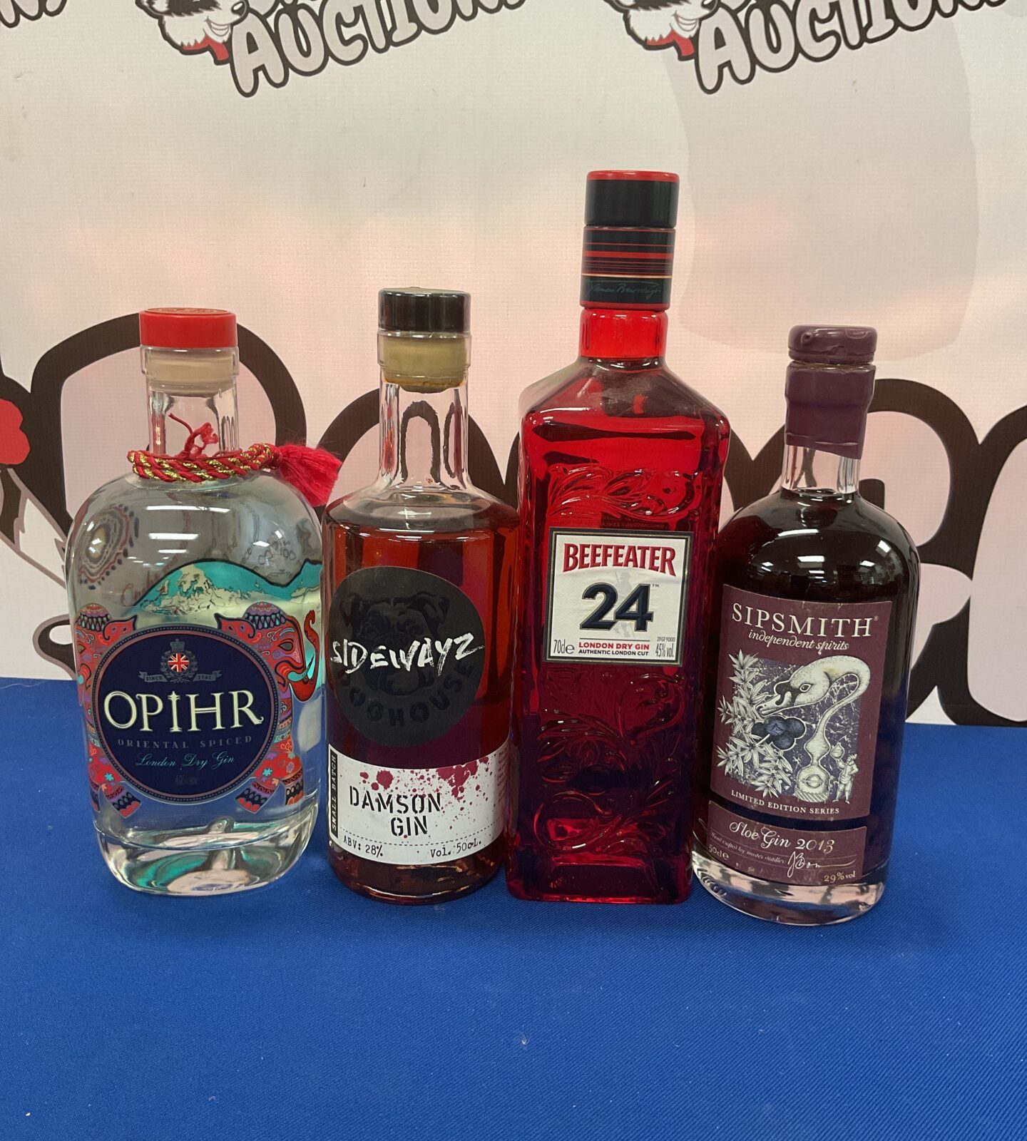 Four bottles gin inc beefeater sloe gin damson gin and oriental spiced ...