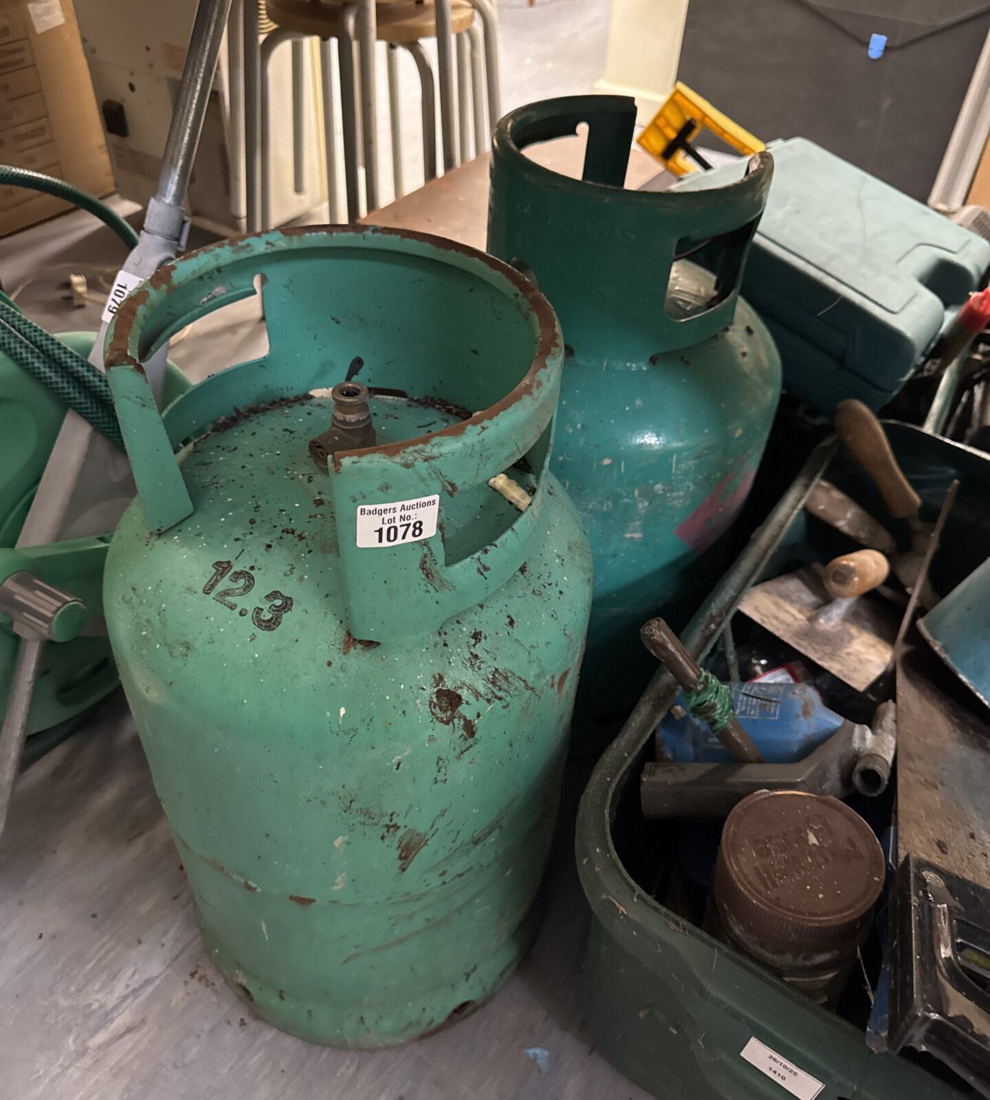 Two patio gas canisters – one empty, one has some contents – Badgers ...