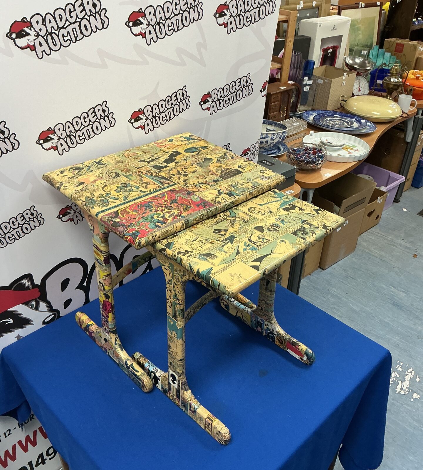 Nest of Tables covered with Comic Hero plastic – Badgers Auctions