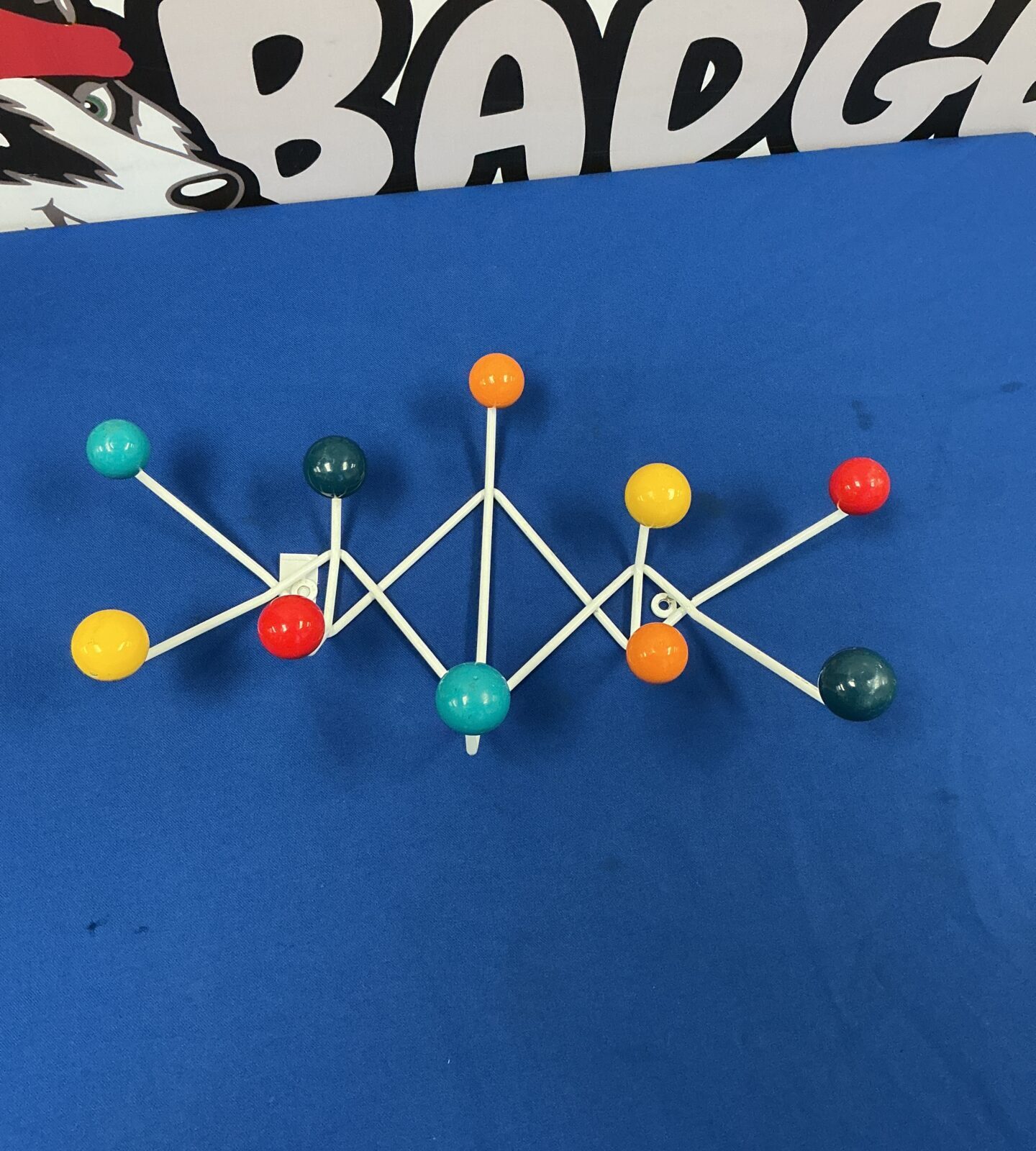 Atom Colourful coat hanger – Badgers Auctions