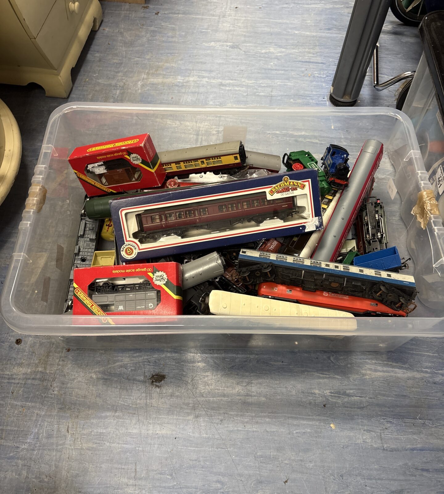 Box full of diecast OoGauge trains and carriages rolling stock inc ...