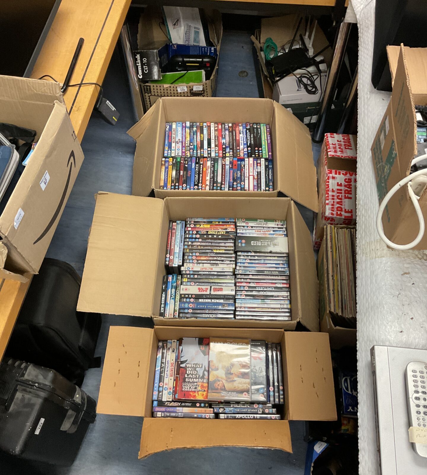 Three boxes of large mixed DVD collection – Badgers Auctions