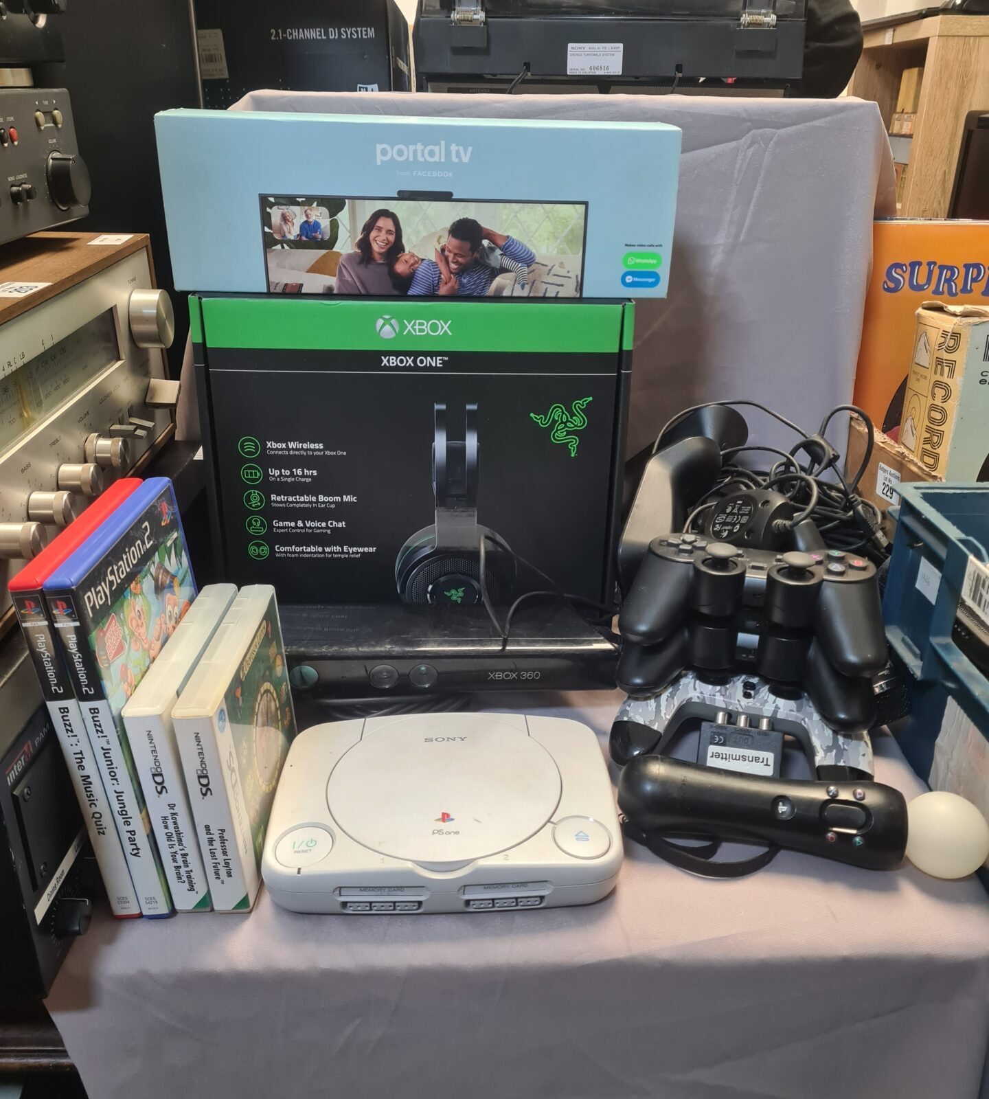 Box of mixed gaming items inc ps1 slim, xbox one razor headset, ps2 ...