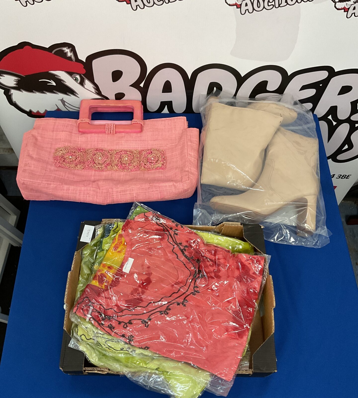 Box of mixed ladies wear inc boots, dresses and a bag – Badgers Auctions
