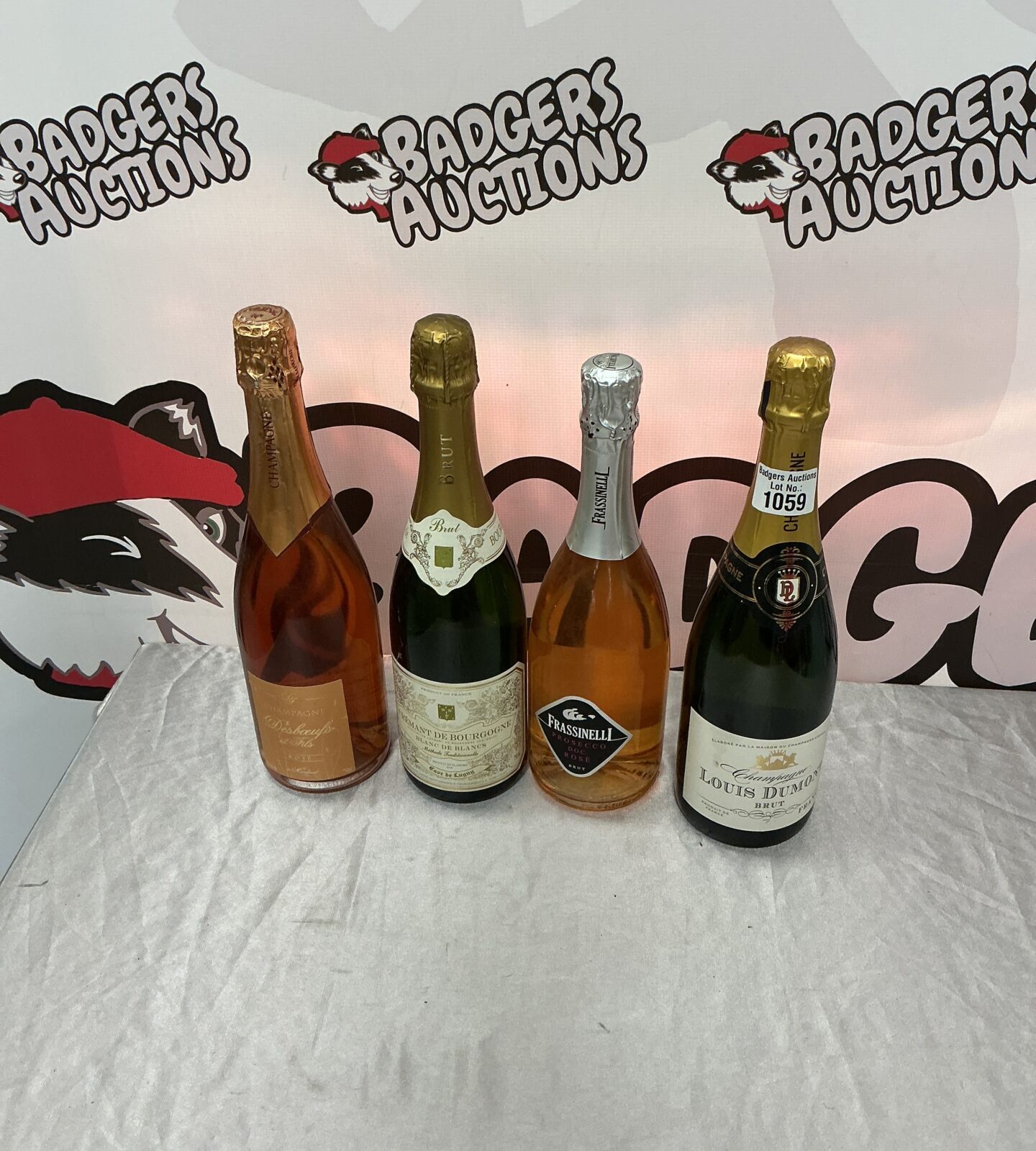 Four bottles of sparkling wine and champagne – Badgers Auctions