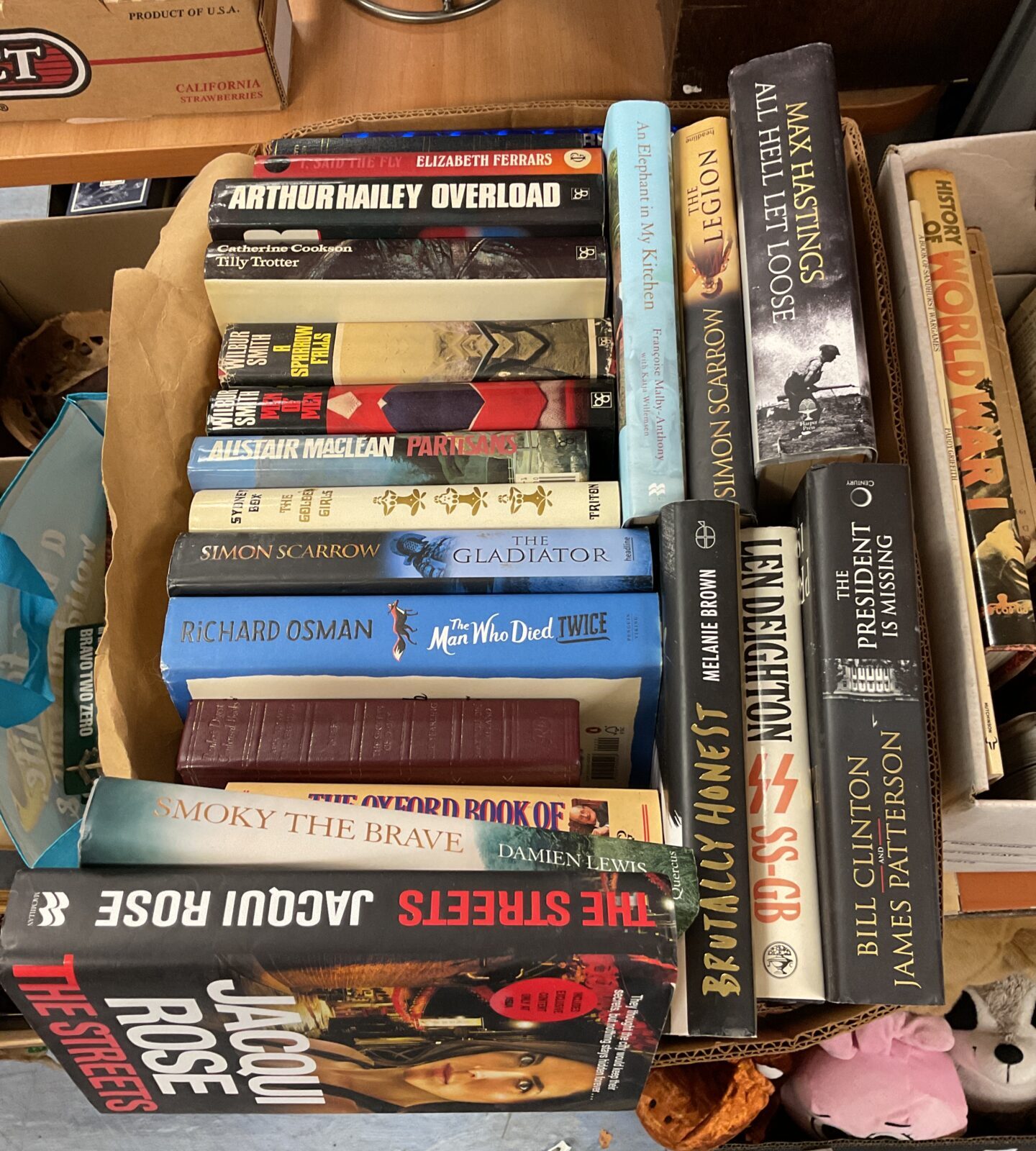Box of hardback books, including Simon scarcrow, wilbur smith and ...