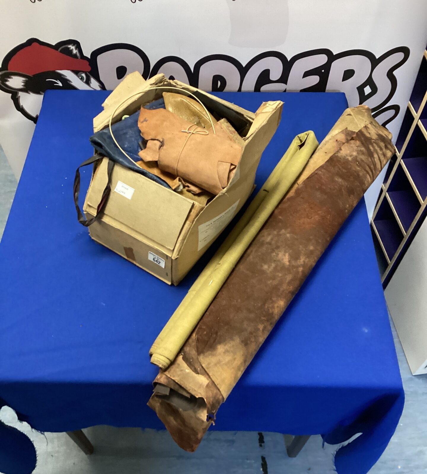 Rolls of leather off cuts and a box of leather off cuts – Badgers Auctions