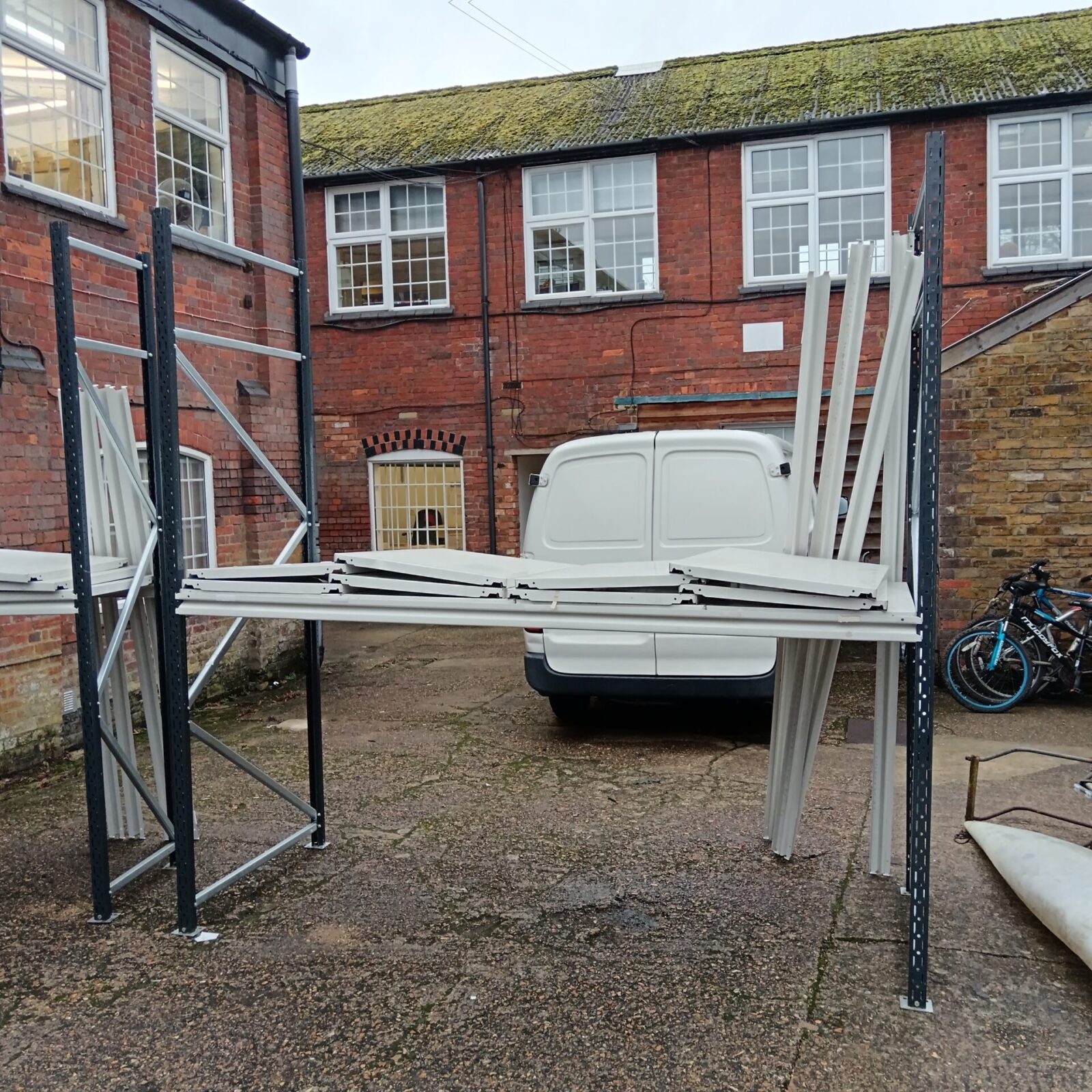Heavy duty grey racking with metal shelving – Badgers Auctions