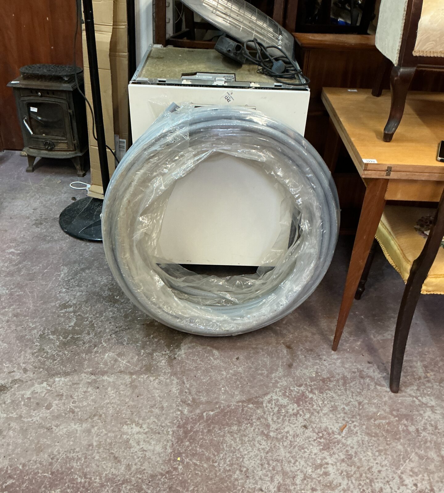 Roll of plastic water pipe – Badgers Auctions