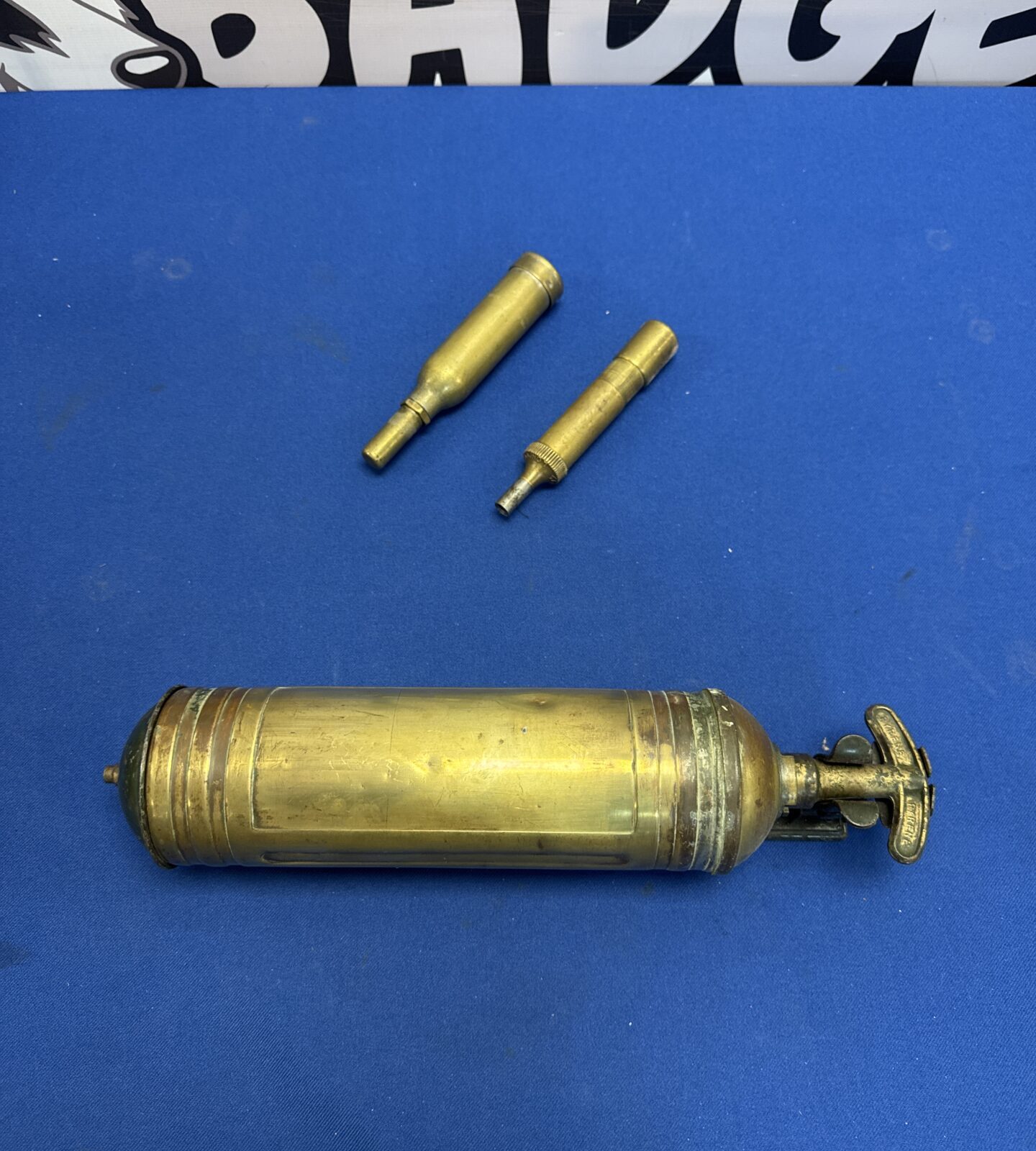 Two vintage brass grease guns with a fire extinguisher – Badgers Auctions