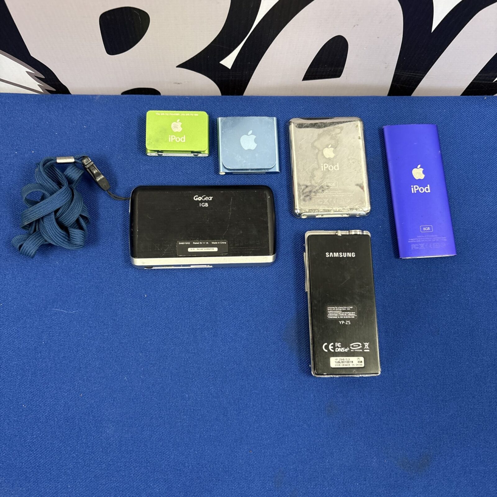 Selection of Apple iPods with Phillips go gear and Samsung mobile phone ...