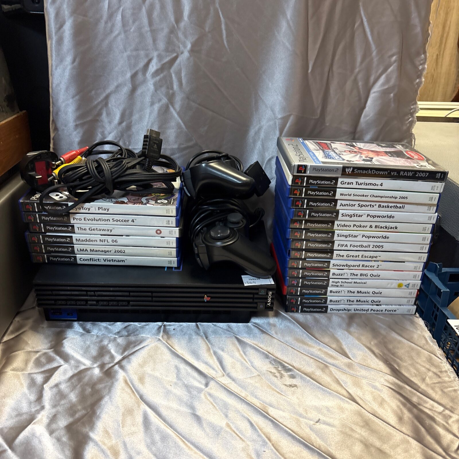 Sony PlayStation two console with games and controllers – Badgers Auctions