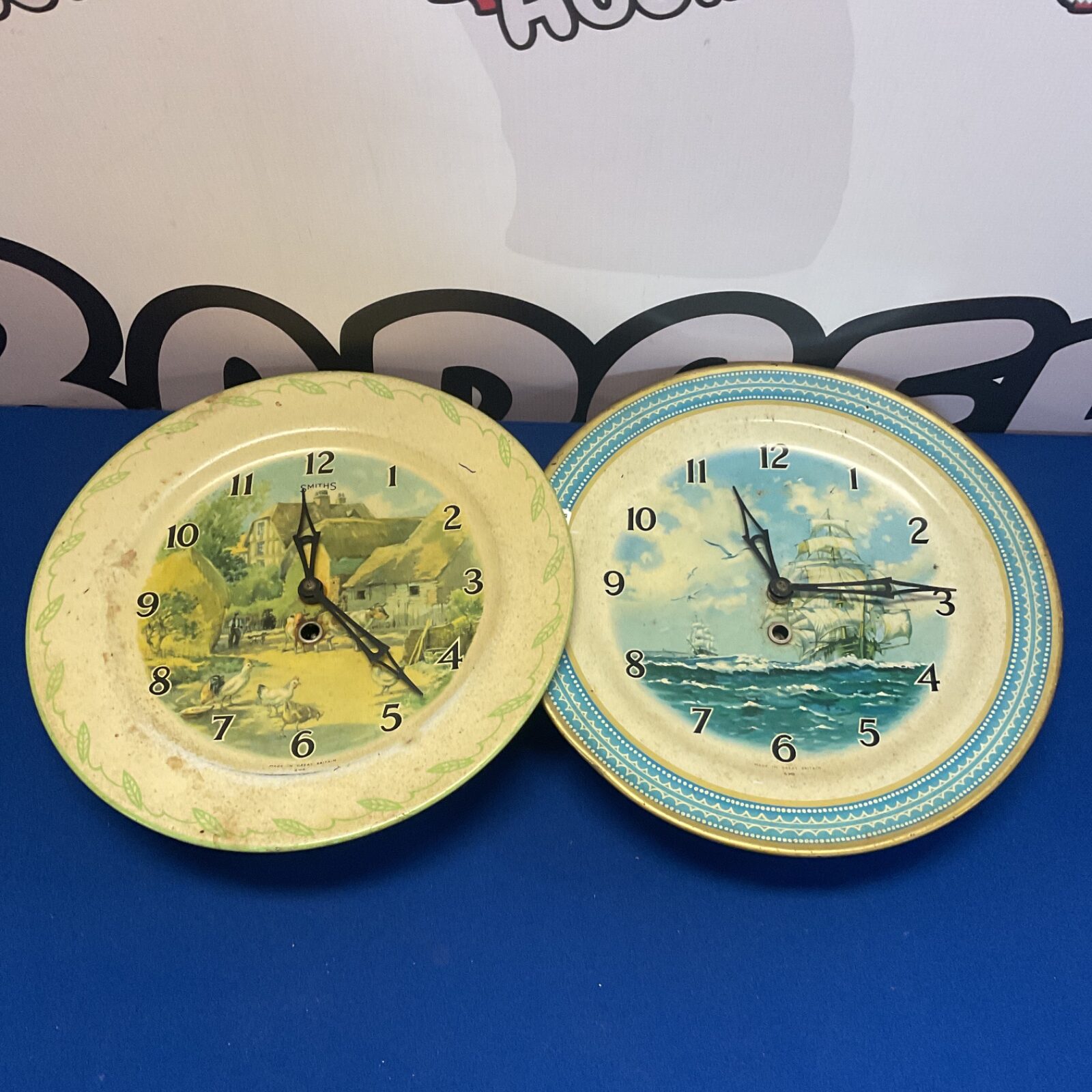 Two vintage tin plate smiths quartz wall clocks – Badgers Auctions