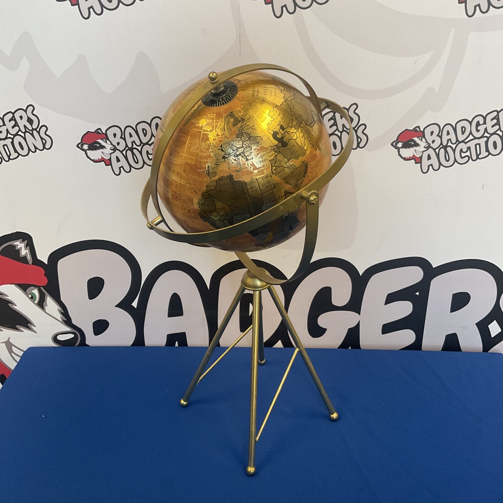 World globe on brass pedestal base – Badgers Auctions